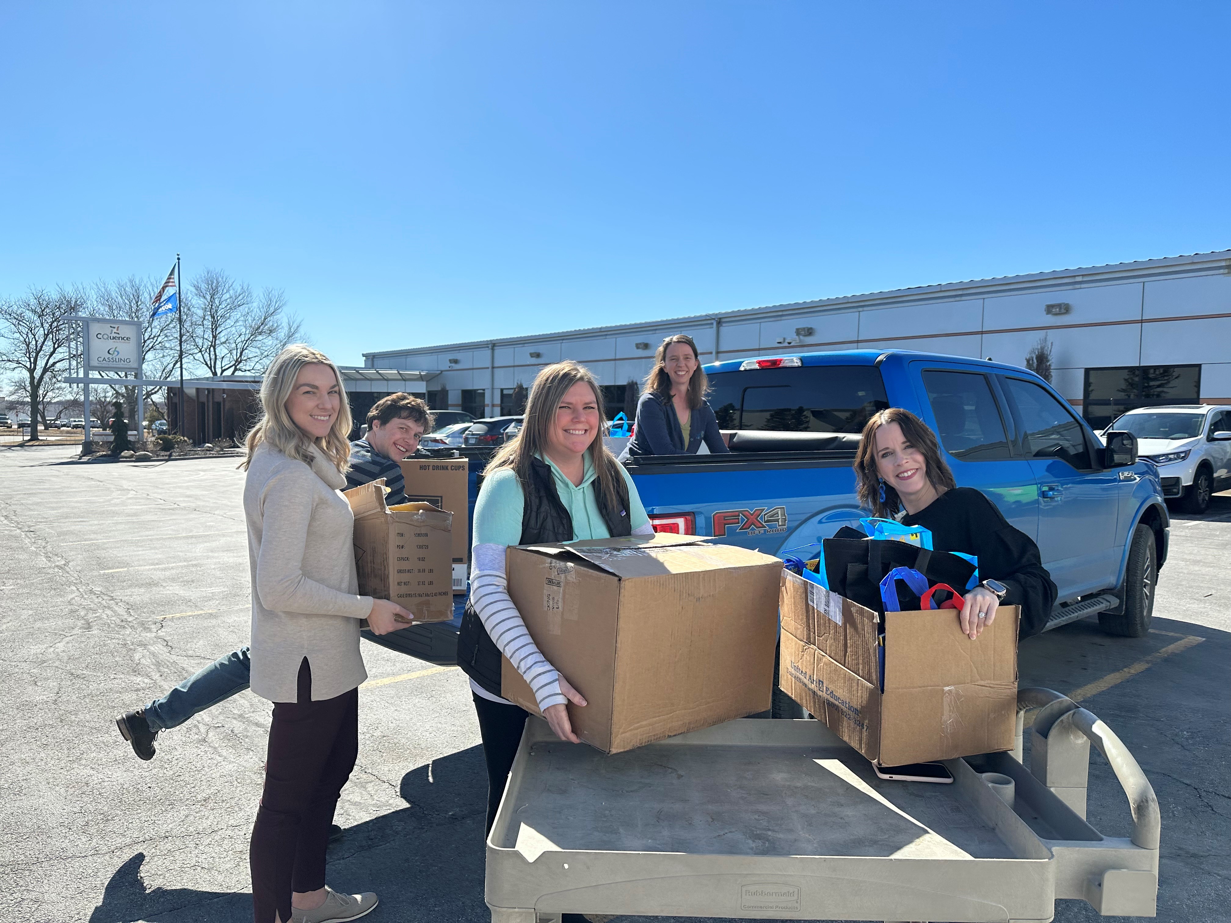Cassling Employees Assemble Kits for a Cause